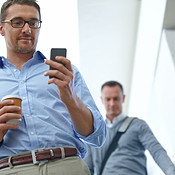 Checking his texts | Buy Stock Photo on PeopleImages, Picture And ...