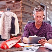 Checking for materials online | Buy Stock Photo on PeopleImages ...