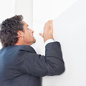 Man peeking over wall | Buy Stock Photo on PeopleImages, Picture And ...