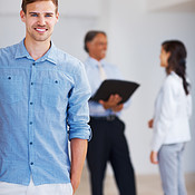 Young business man with staff | Buy Stock Photo on PeopleImages ...