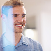 Handsome young man looking through glass | Buy Stock Photo on ...