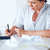 Busy calculating taxes | Buy Stock Photo on PeopleImages, Picture And ...