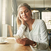 Having a laid back time at her favorite coffee shop | Buy Stock Photo ...