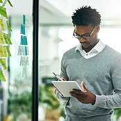 Making technology work for him | Buy Stock Photo on PeopleImages ...