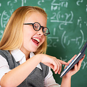 Having fun with maths on the calculator | Buy Stock Photo on ...