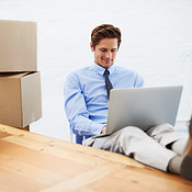 Catching up on work after the move | Buy Stock Photo on PeopleImages ...
