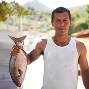 Showing off his catch | Buy Stock Photo on PeopleImages, Picture And ...