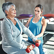 Working together to improve muscle strength and tone | Buy Stock Photo ...