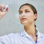 Solving equations to find all the solutions she needs | Buy Stock Photo ...