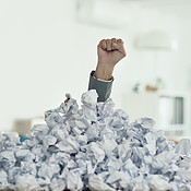 Fighting his way through the paperwork | Buy Stock Photo on ...