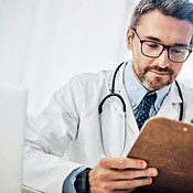 Getting to know his patient through medical records | Buy Stock Photo ...