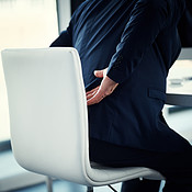 His back is carrying his workload | Buy Stock Photo on PeopleImages ...