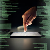 Cracking codes on a different device | Buy Stock Photo on PeopleImages ...