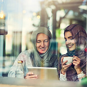 Keeping up with social media trends with a friend | Buy Stock Photo on ...