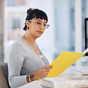 Double-checking paperwork is essential to business | Buy Stock Photo on ...