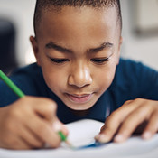 Getting his homework done before playtime | Buy Stock Photo on ...