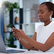 Making big plans happen with her connections | Buy Stock Photo on ...