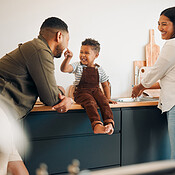 Parents, child and home of a beautiful, loving and caring family being ...