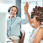 High five, excited and celebrating call center agents with computers ...