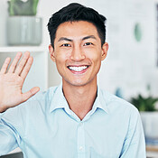 Happy business man greeting, waving and saying hello with hand gesture ...