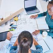 Architect blueprints, engineers and designers analyzing drawing, draft ...