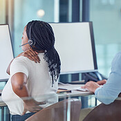 Pain, injury and muscle with a woman call center agent or support staff ...