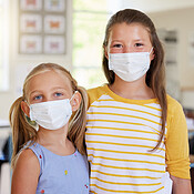 Young kids learning in classroom, after covid pandemic, wearing face ...