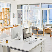 Empty office room, workplace or interior with a desk, computers and ...