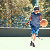Sports, athlete and child basketball player training for a match on an ...