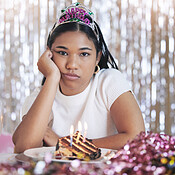 Bored, angry and birthday girl at a party at a celebration event with ...