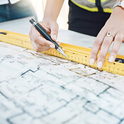 Hands, blueprint and architect planning with an architecture design and ...