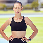 Woman, fitness and runner at stadium track for training, exercise and ...