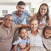 Happy big family, smile and sofa portrait in home living room, bonding ...