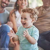 Baby, clapping hands and excited toddler boy feeling happy, playful and ...