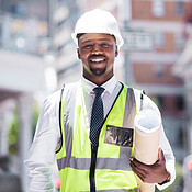 Business, builder and contractor man holding building plans with a ...