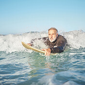 Ocean waves, senior man surfing on beach and healthy fitness lifestyle ...