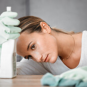 Spring cleaning house, tired and sad woman in home living room with ...