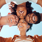 Diversity, community and friends in a circle, relax, smile and bond while having fun in a city ...