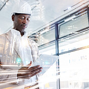 Tablet, city overlay and architect or black man with engineering ...