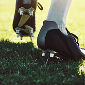 Soccer shoes, soccer player and soccer field by man for training ...