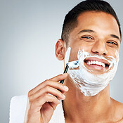 Skincare, facial and man shaving beard or face hair for cleaning cream ...
