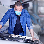 Mechanic, engine and car, man with face mask for covid safety at auto ...