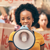 Protest, loud speaker and rally with a woman activist speaking during a ...