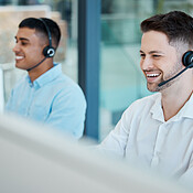 Happy call center, consultant man laugh on customer service phone call ...