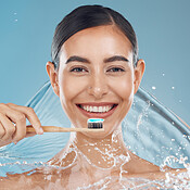 Woman brushing teeth, water splash and toothbrush, toothpaste and ...