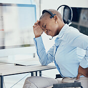 Black woman, backache and stress in call center with consultant ...