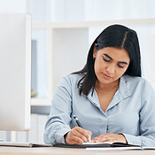 Business woman writing notes, schedule and planning ideas, meeting ...
