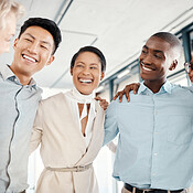 Happy, team building and business people hug in a meeting for ...