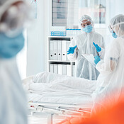 Covid, death and doctors writing report in a hospital for compliance ...