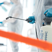 Covid disinfection, red tape and man in hazmat suit to safety protect ...